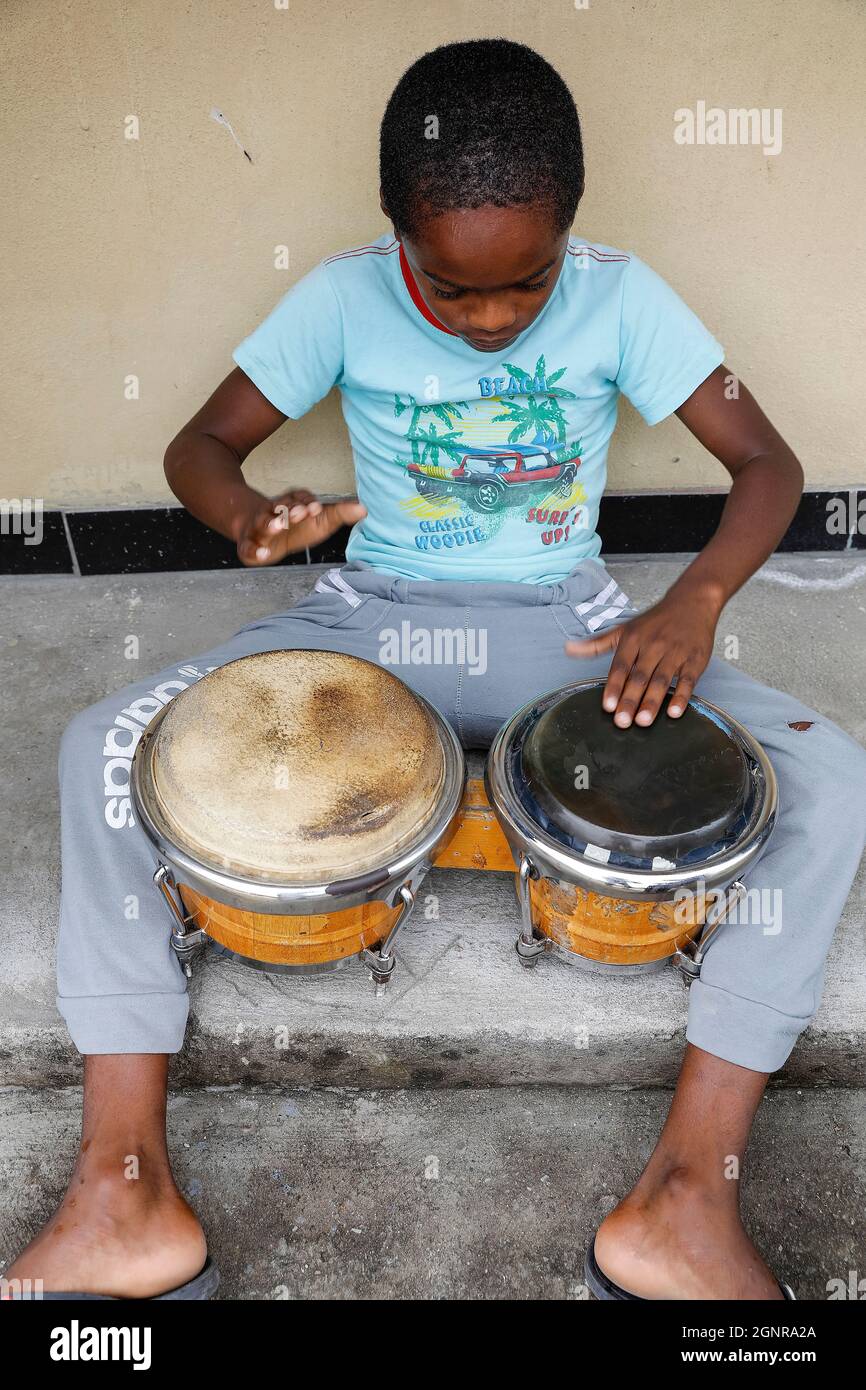 Afro-Ecuadorian boy playing drums in Valle del Chota, Ecuador Stock ...