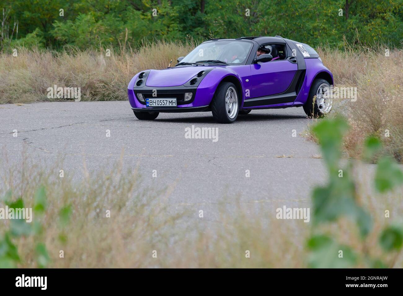 The little Lilac car enters the corner. The Smart Roadster is a two ...