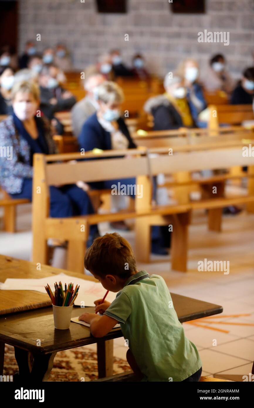 Notre Dame de Plaimpalais church. Catholic mass. Child during the ...