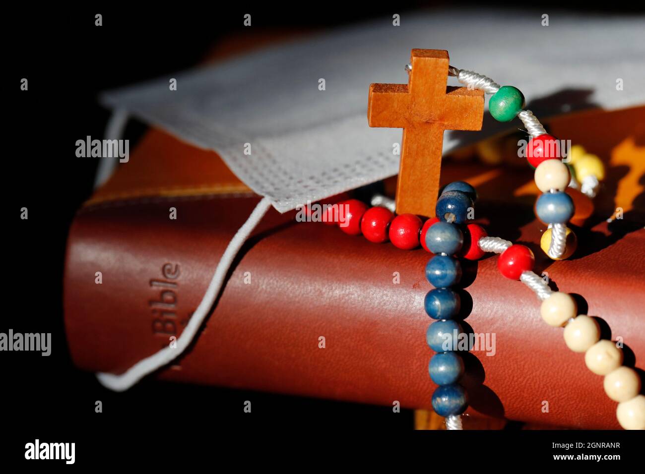 Bible, rosary and surgical mask in church. Coronavirus pandemic. France ...
