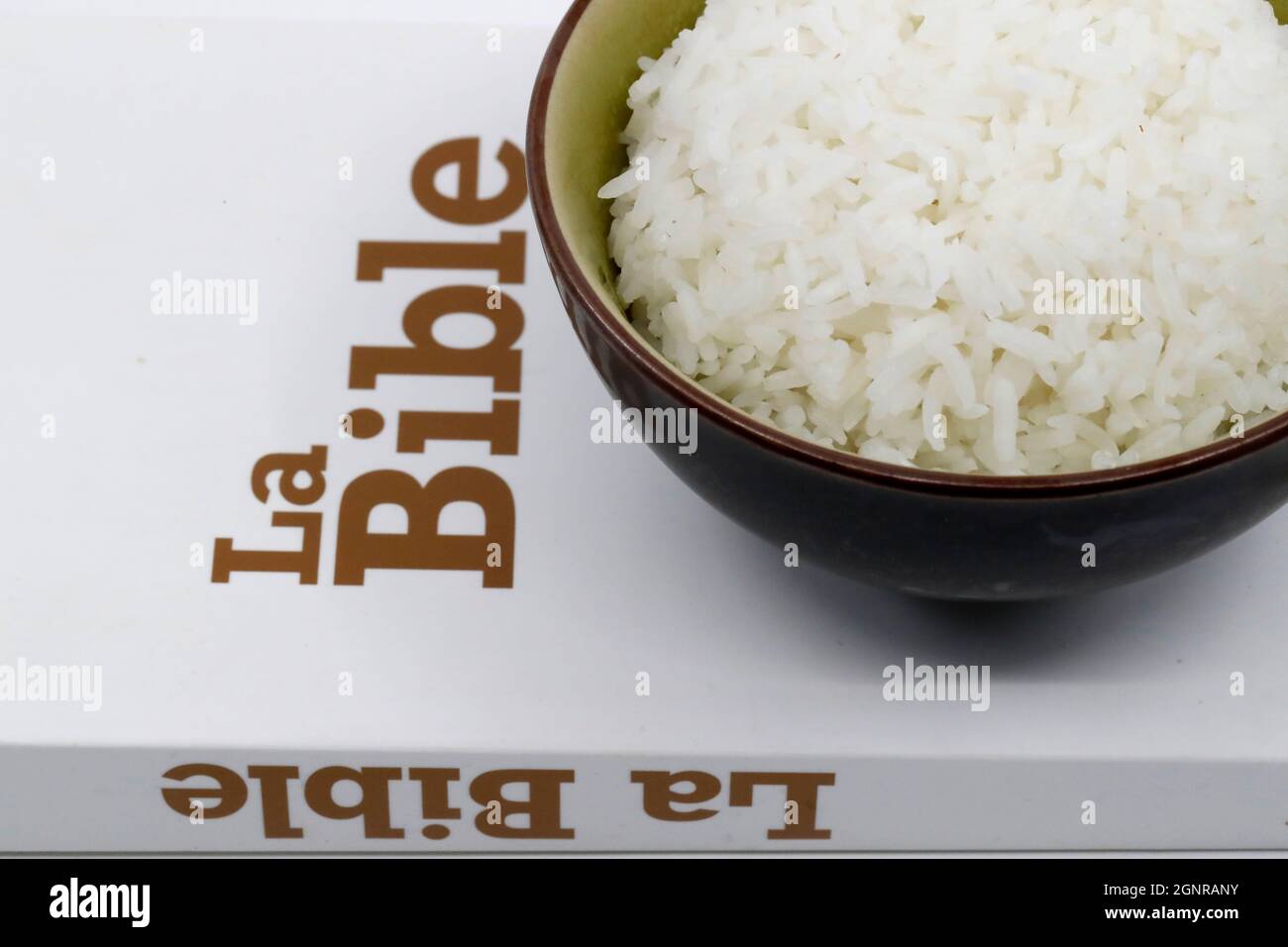 Bowl of rice and Bible during Lent. A solemn religious observance that ...