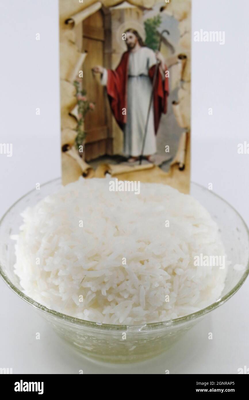 Image of Jesus and bowl of rice during Lent. A solemn religious ...