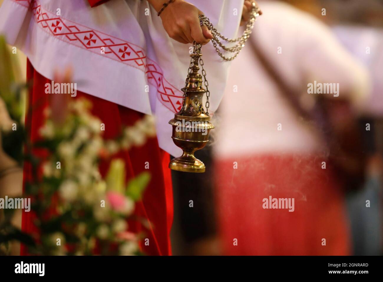 Saint Francois de Sales basilica. Thurifier swinging the thurible ...