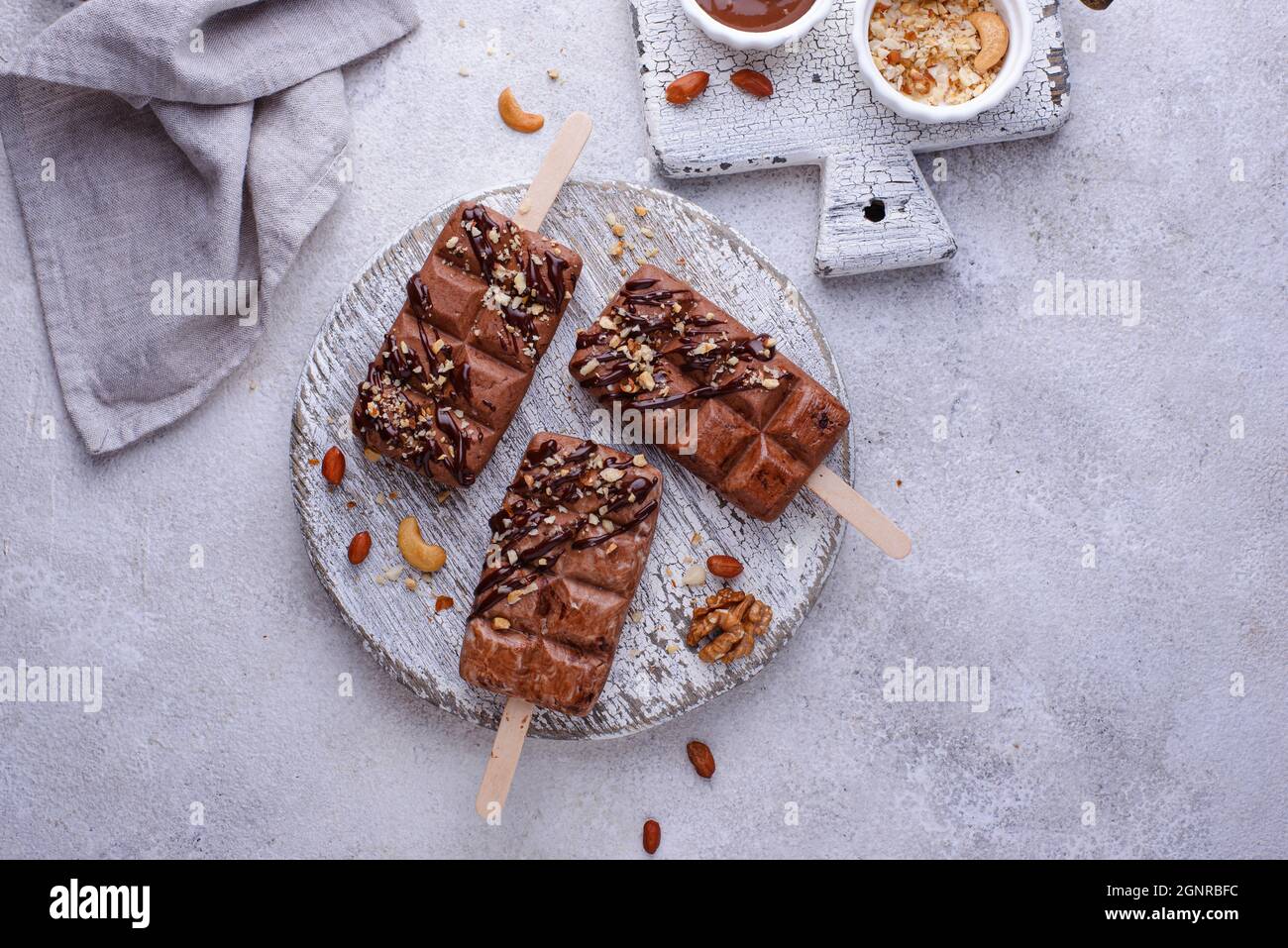 Chocolate ice cream popsicle with nut Stock Photo - Alamy