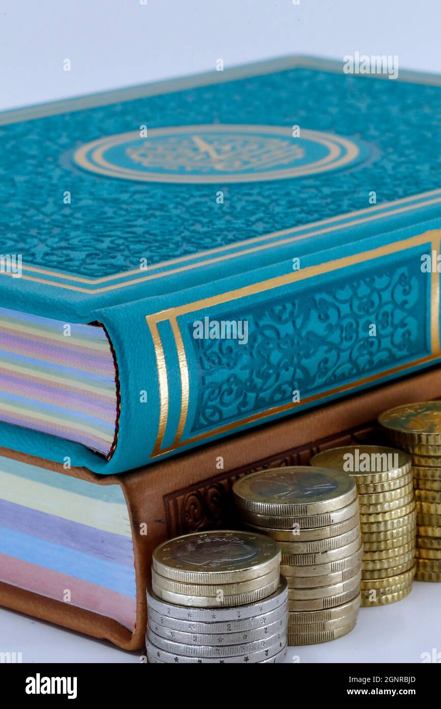 Coins of euro currency. Islamic finance and economy concept with Quran ...