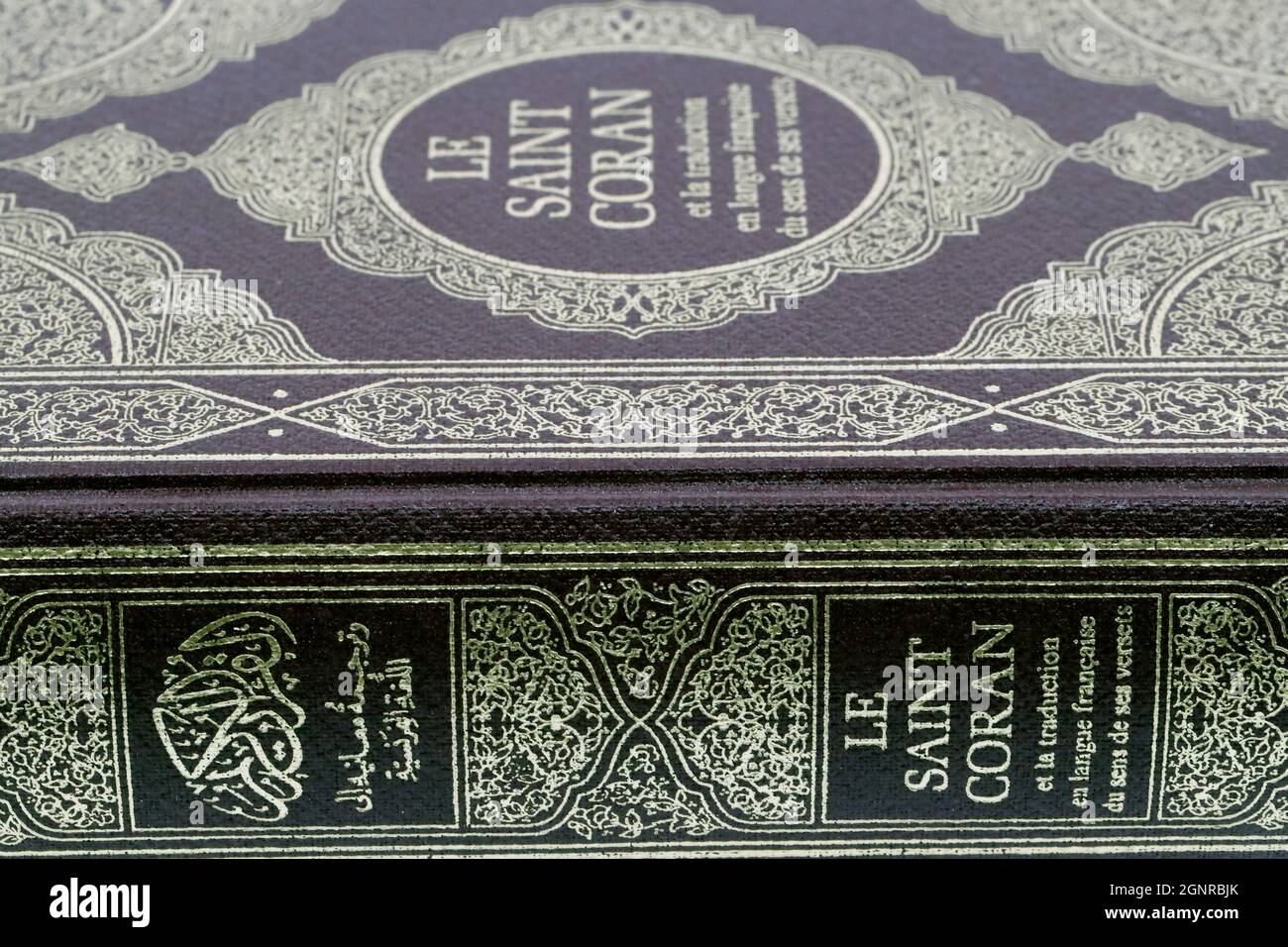 Cover of the Holy Quran in french. Religious text Stock Photo - Alamy