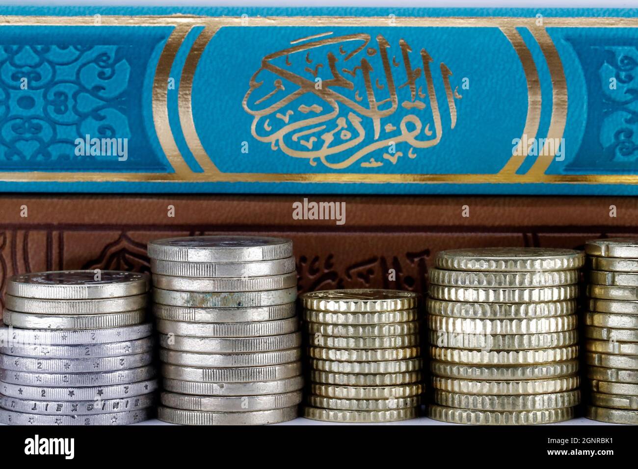 Coins of euro currency. Islamic finance and economy concept with Quran ...