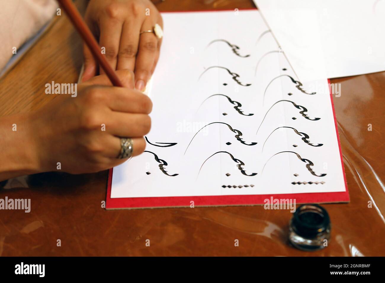 Calligraphy lesson at the Great Paris Mosque, France Stock Photo - Alamy