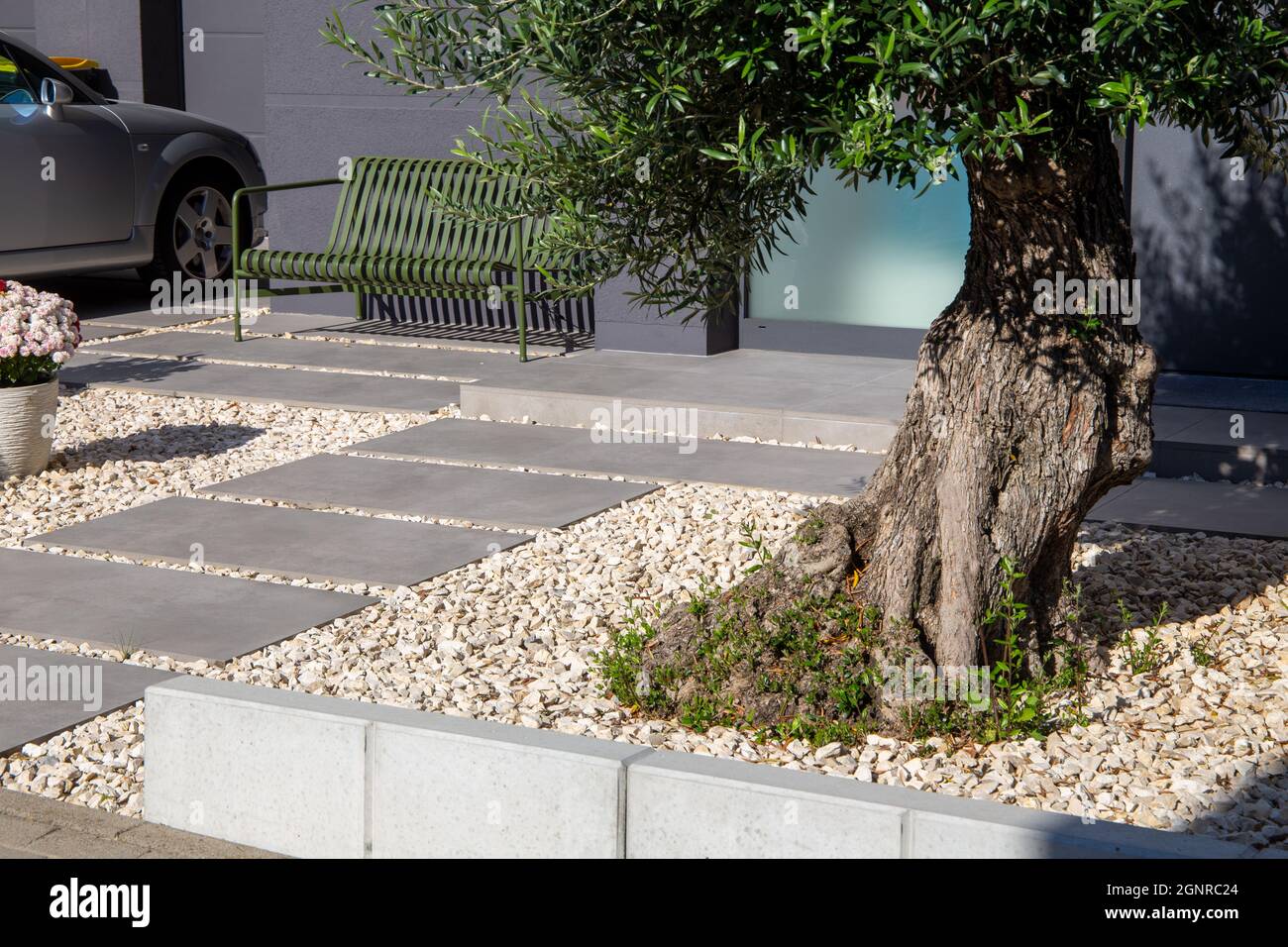 Beautifully landscaped front garden with decorative chippings and an ...