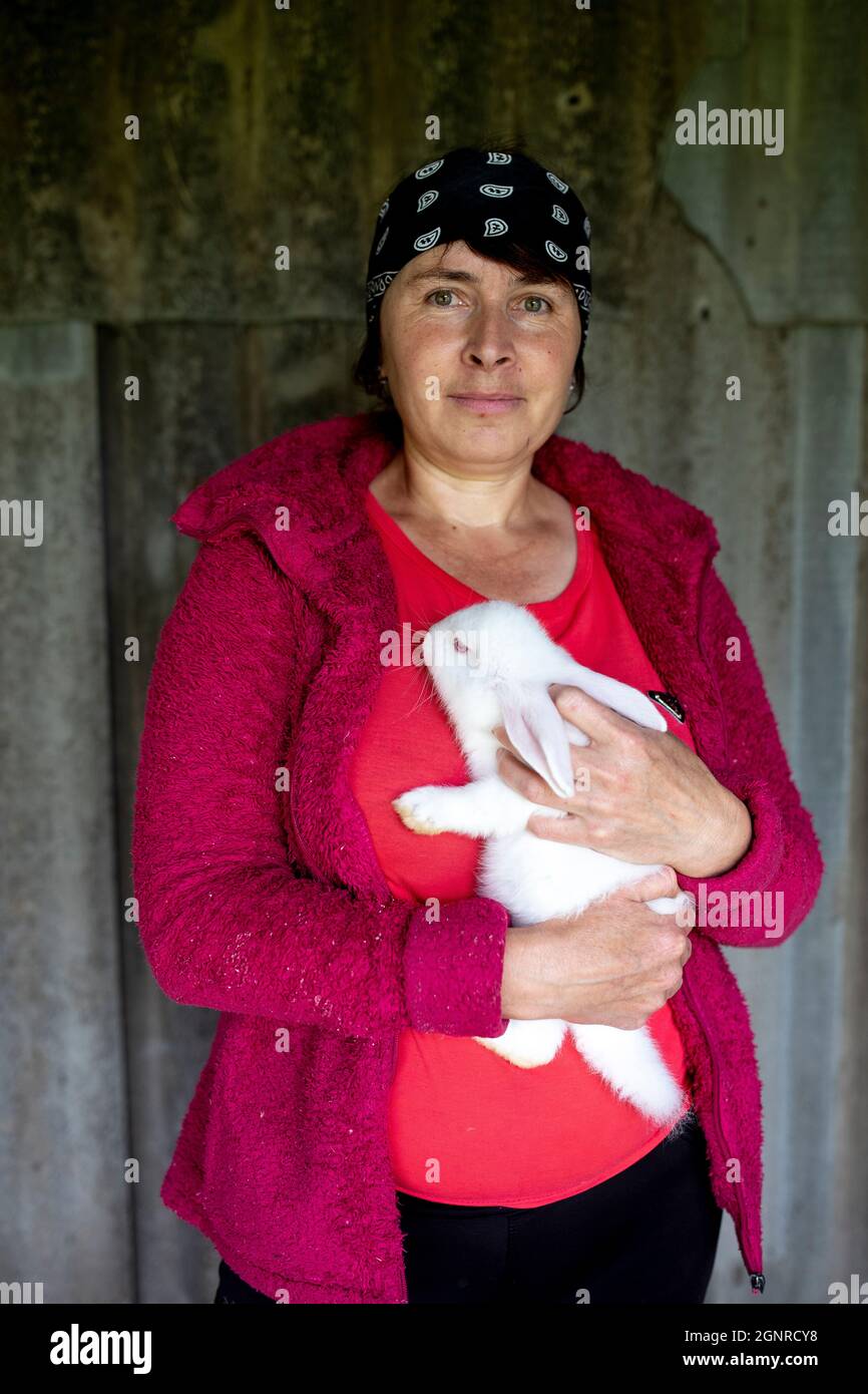 Microfinance institution client raising rabbits in Pirlitza, Moldova ...