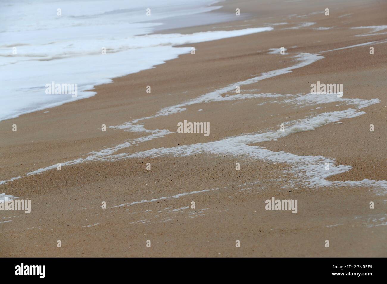 Wet sand after de rain. Nazare. Portugal Stock Photo - Alamy