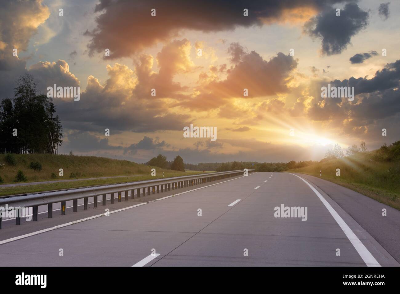 Evening sun view. Bridge on the highway, roadside and asphalt, in ...
