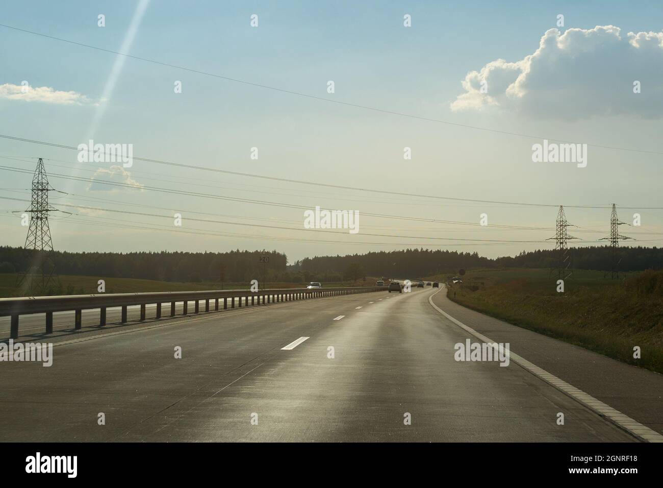highway road in the countryside, roadside and asphalt, green forest and ...