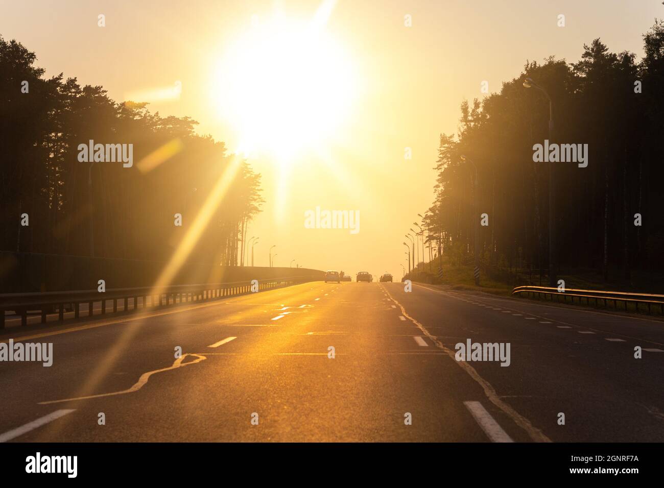 Evening sun view. Bridge on the highway, roadside and asphalt, in ...