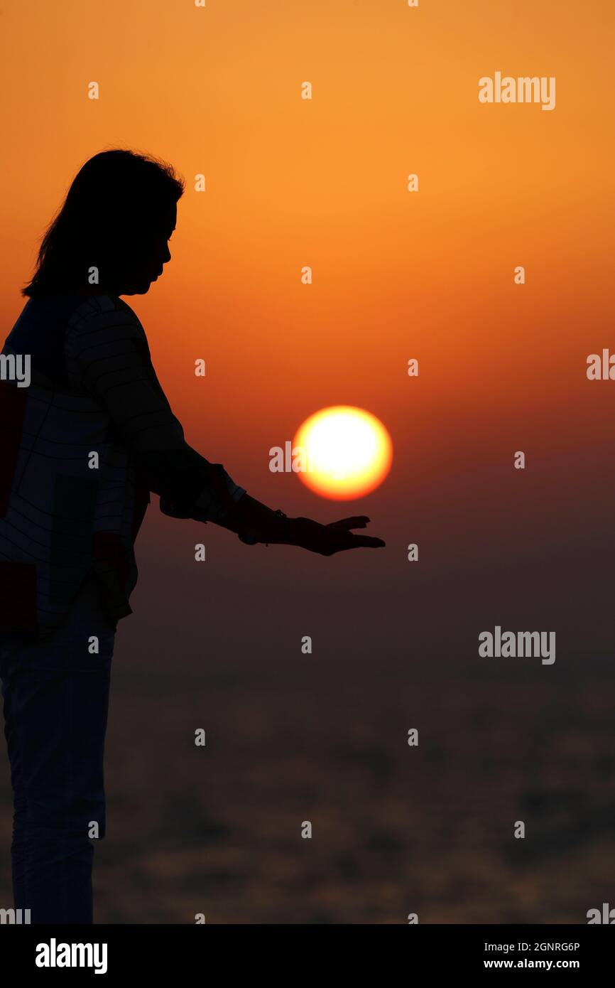 Holding the sun hi-res stock photography and images - Alamy