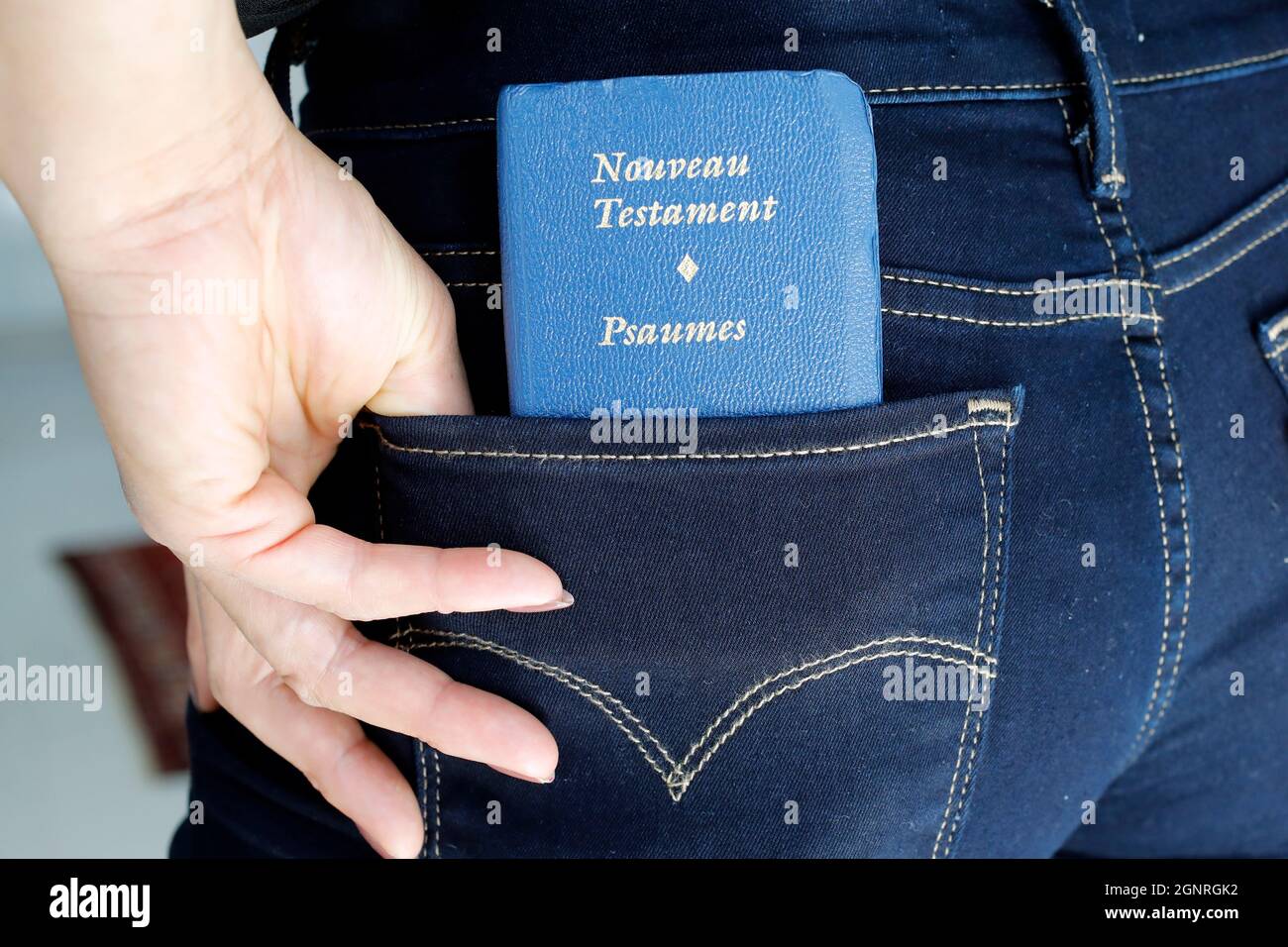 New testament pocket bible in a jeans pocket Stock Photo - Alamy