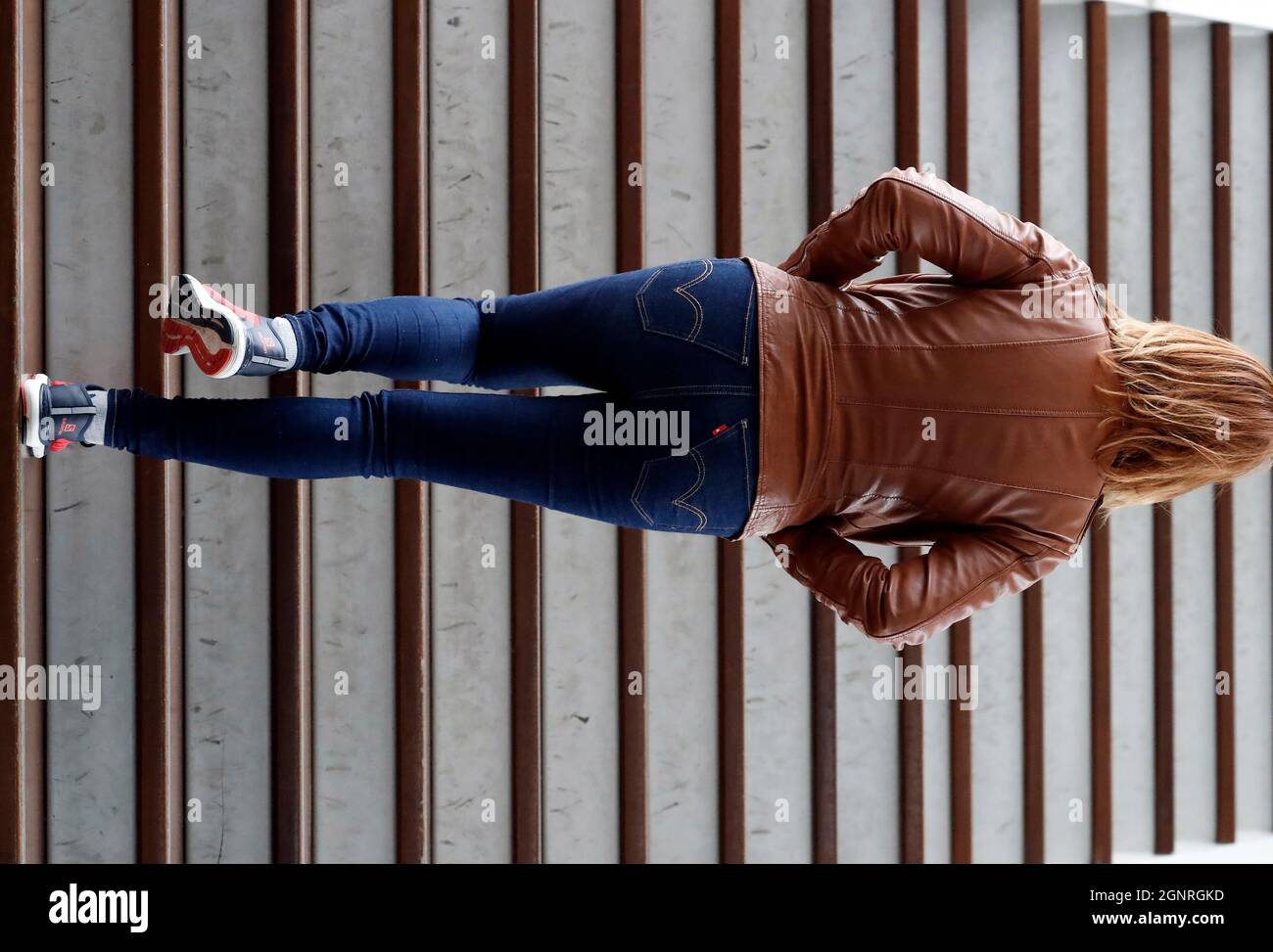 Back side view of a woman walking up the stairs. Genoa. Italy Stock ...