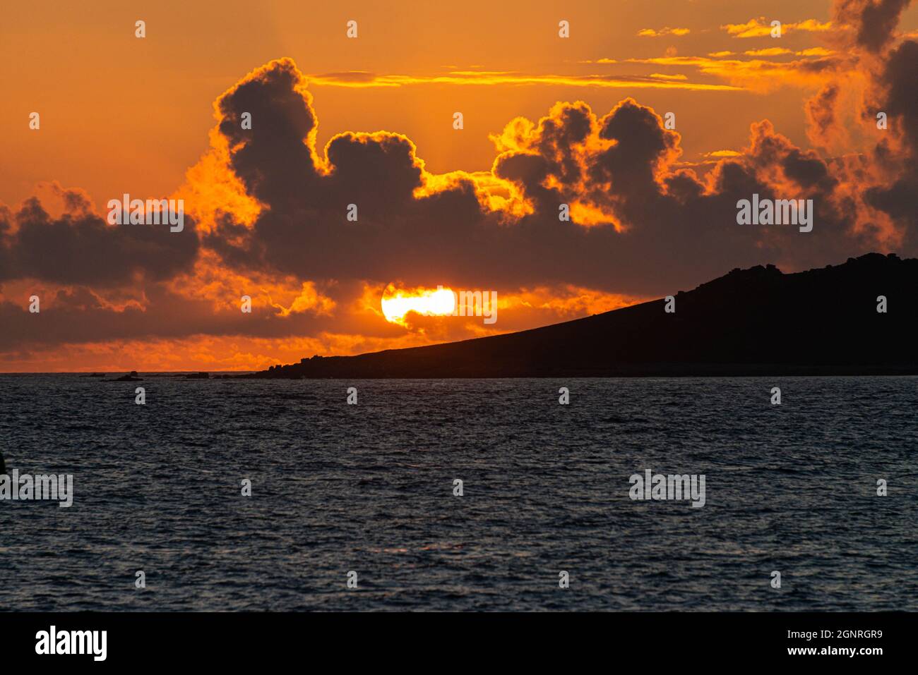 The sun setting behind Samson, Isles of Scilly Stock Photo - Alamy