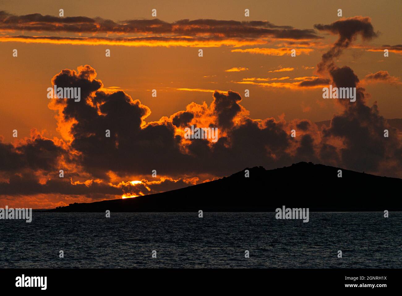 The sun setting behind Samson, Isles of Scilly Stock Photo - Alamy