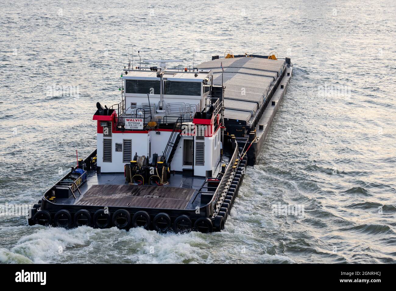 Pusher boat pushing a barge along the river, as seen from above Stock ...