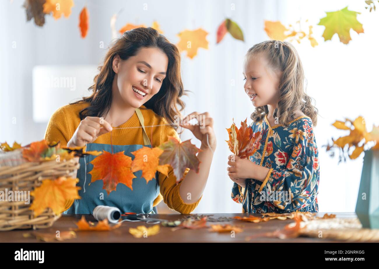 Happy family doing autumn decor. Fall atmosphere Stock Photo - Alamy
