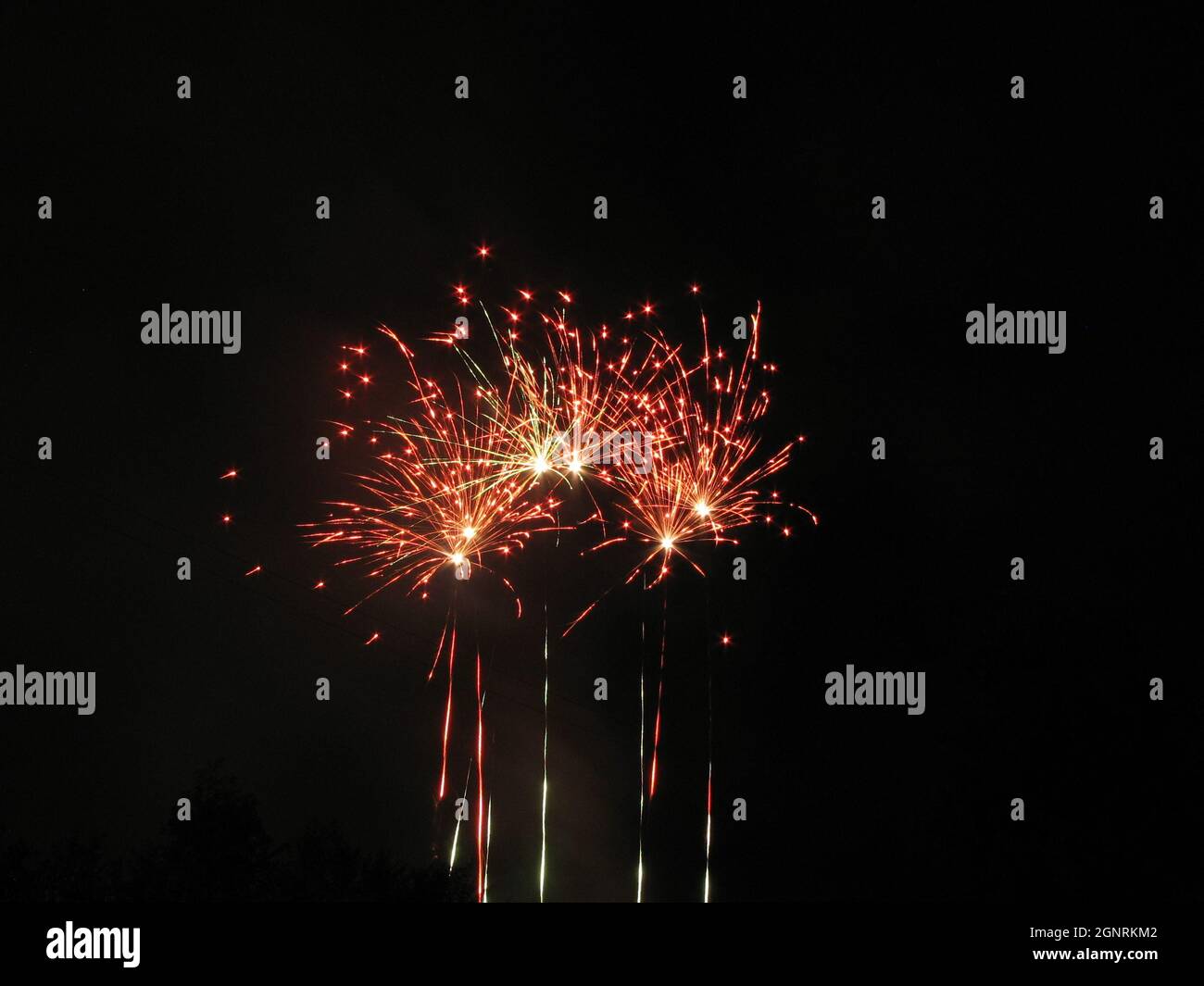 Bright fireworks in the dark night sky Stock Photo - Alamy