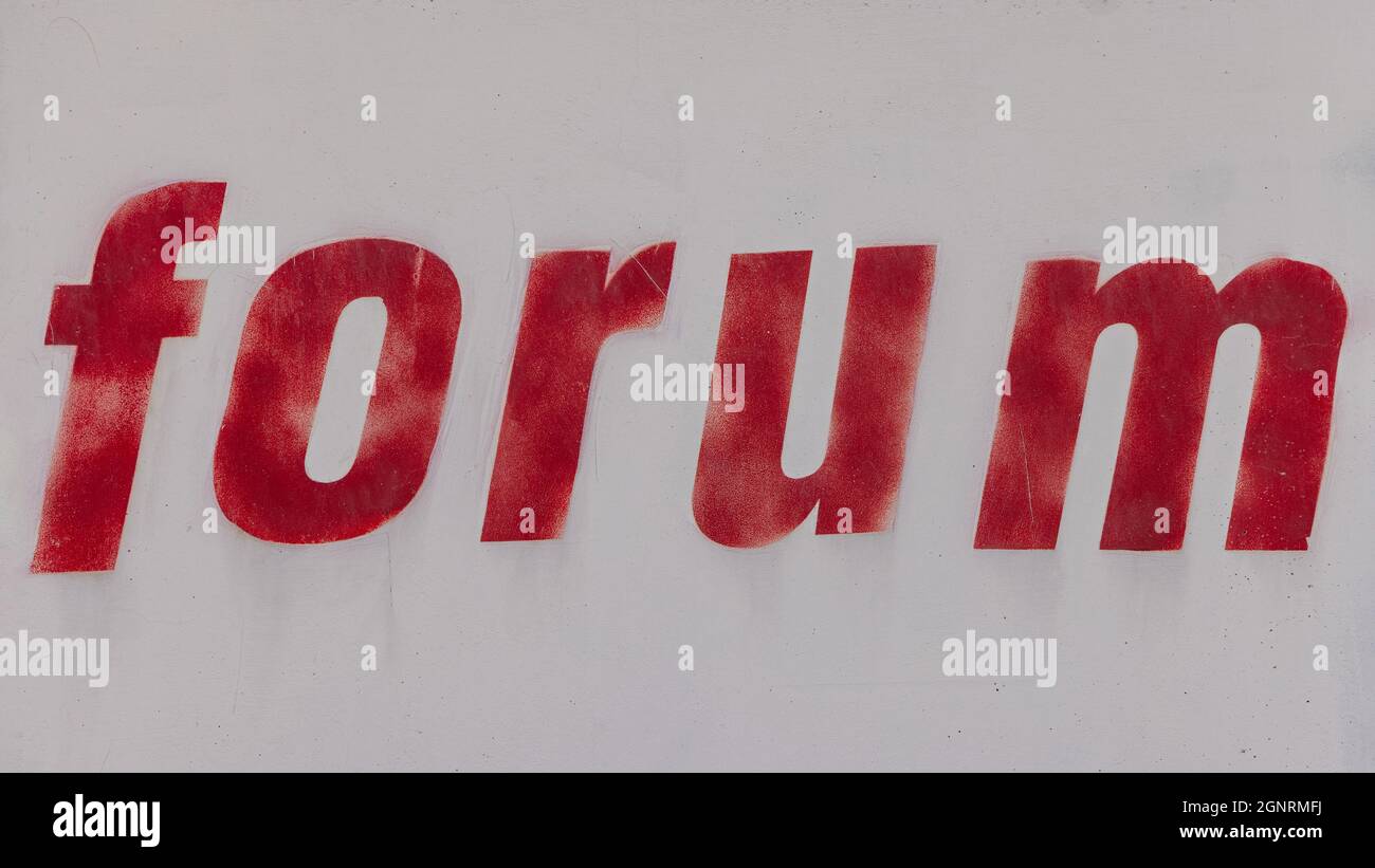 Stencil Spray Paint Sign Forum at White Wall Stock Photo - Alamy