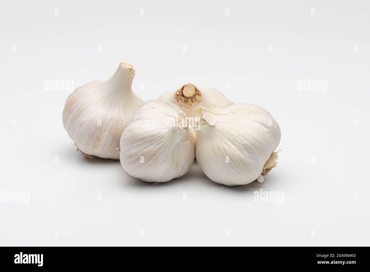 Four cloves of fresh garlic Stock Photo - Alamy