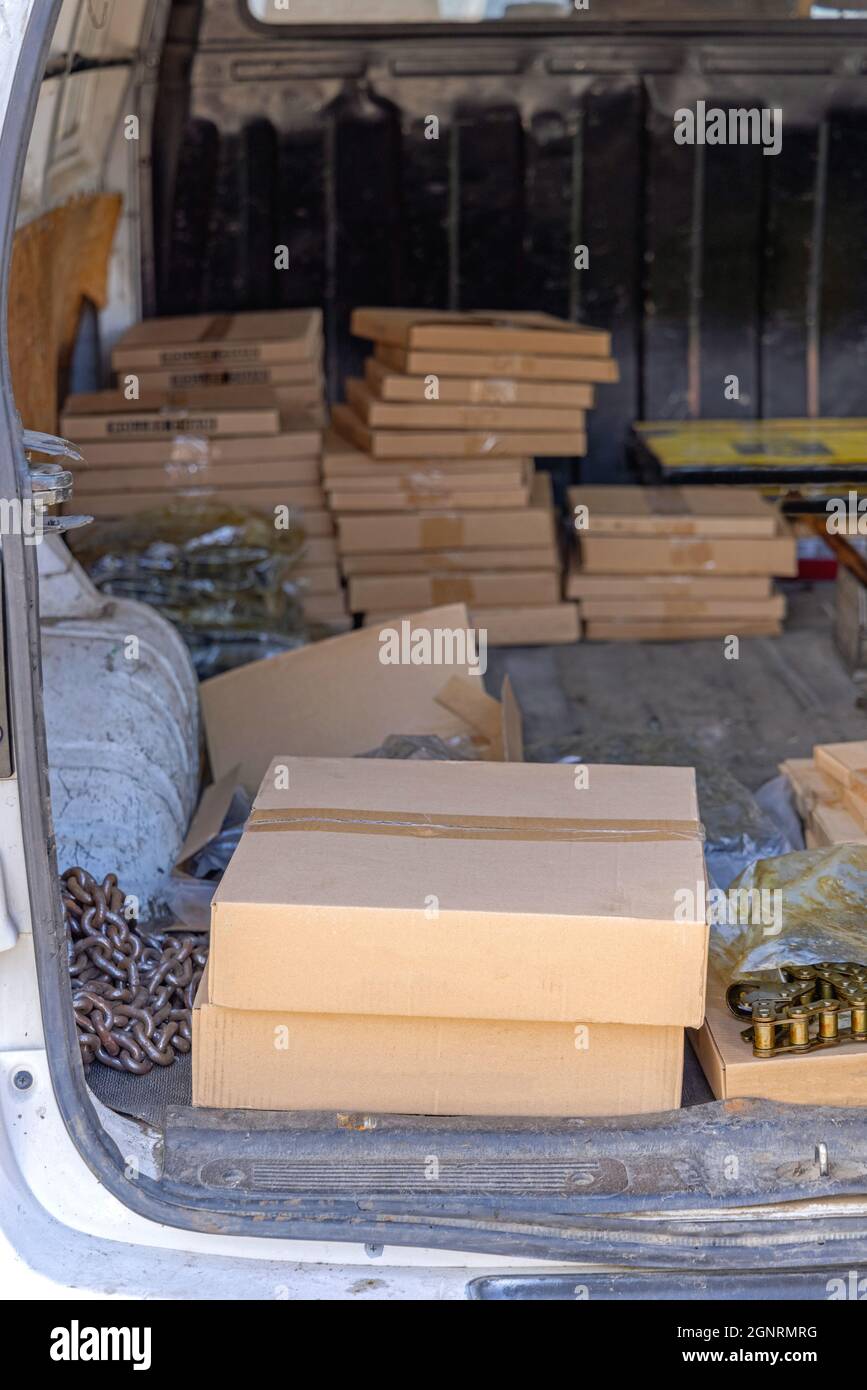 Cardboard Boxes With Spare Parts in Delivery Van Stock Photo - Alamy