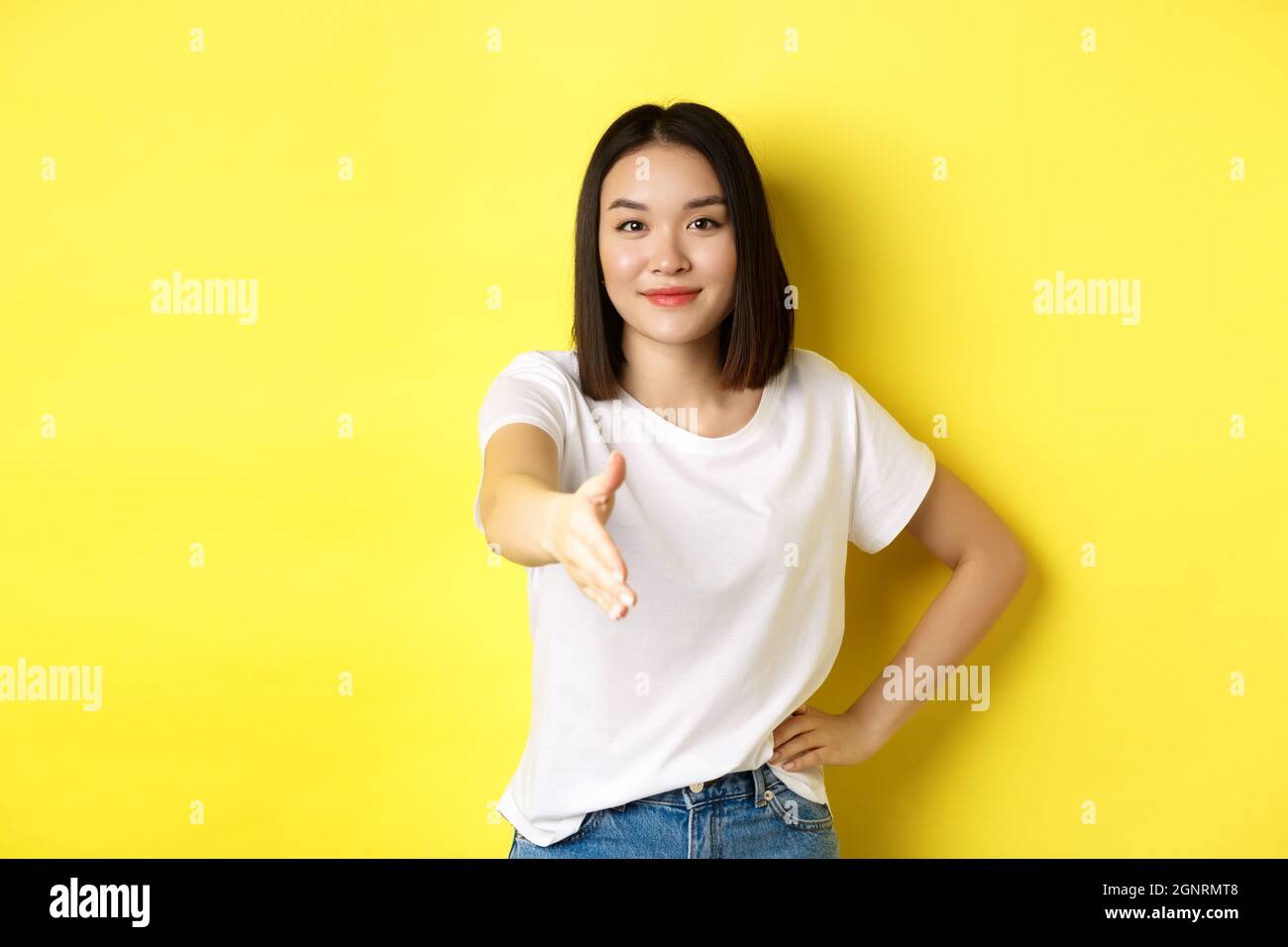 Confident asian woman in white t-shirt, stretch out hand for handshake ...