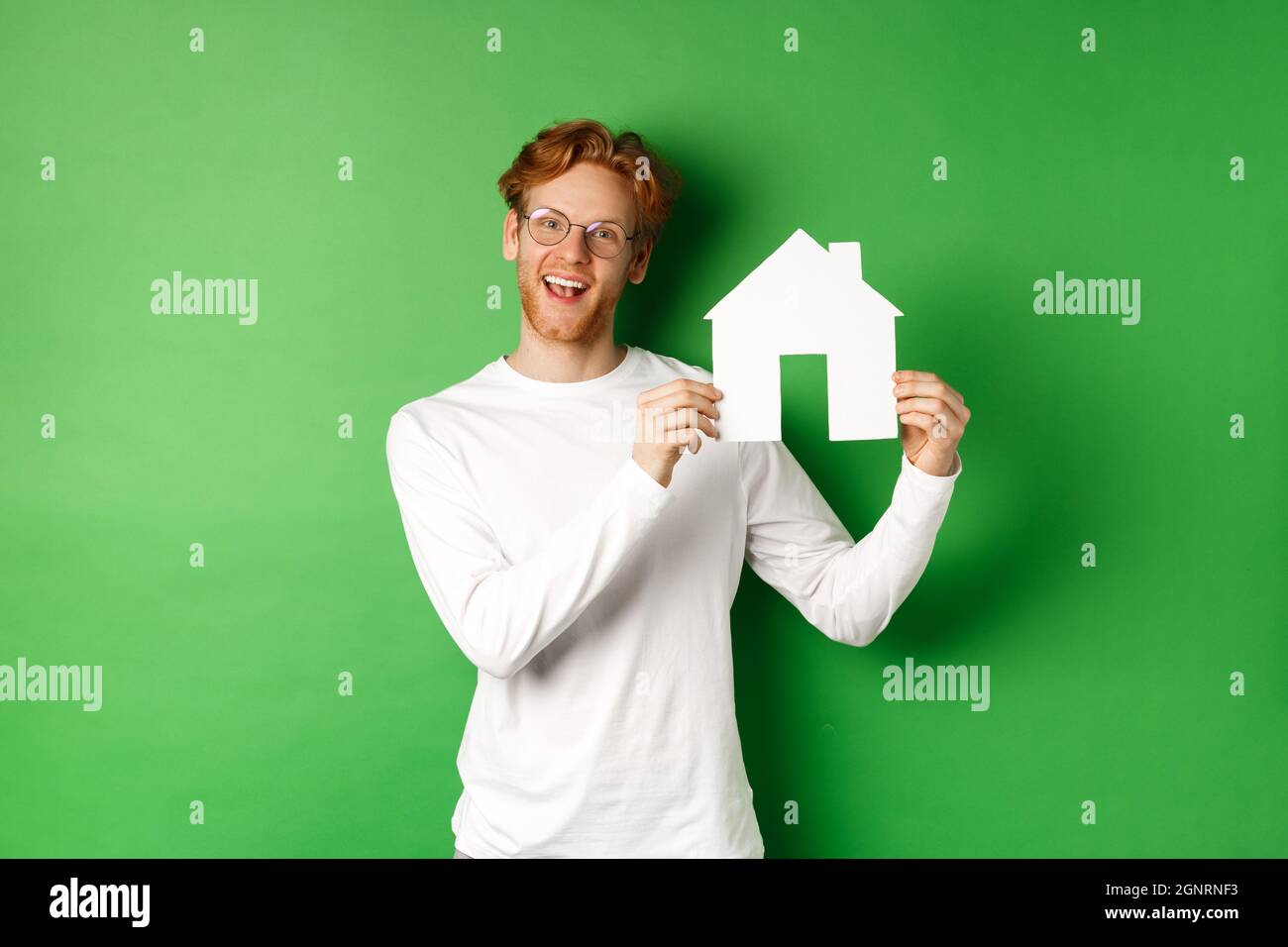 Real estate and buying property concept. Handsome young man with red ...