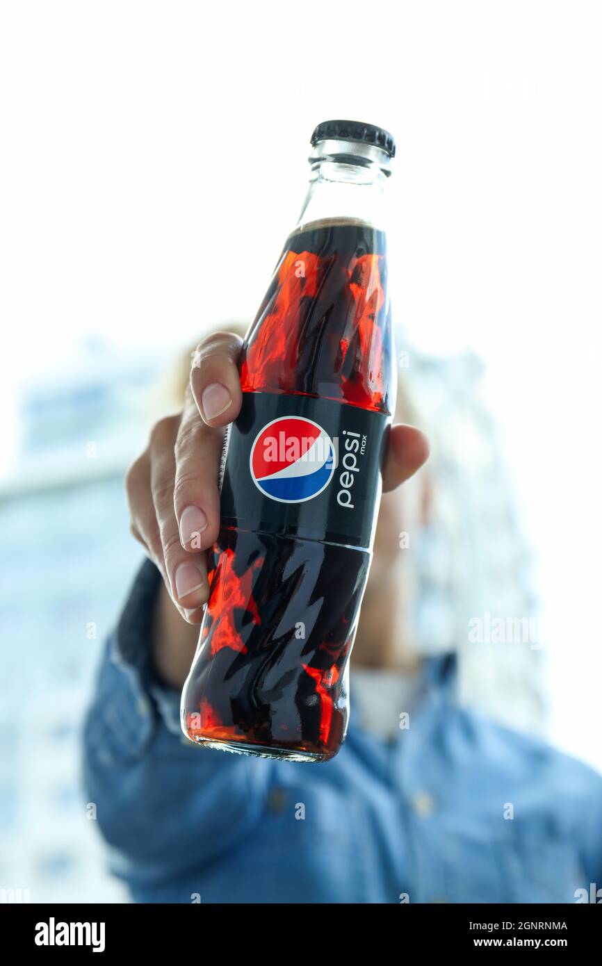Odessa, Ukraine - September 23, 2021: Woman holds Pepsi bottle outdoor ...
