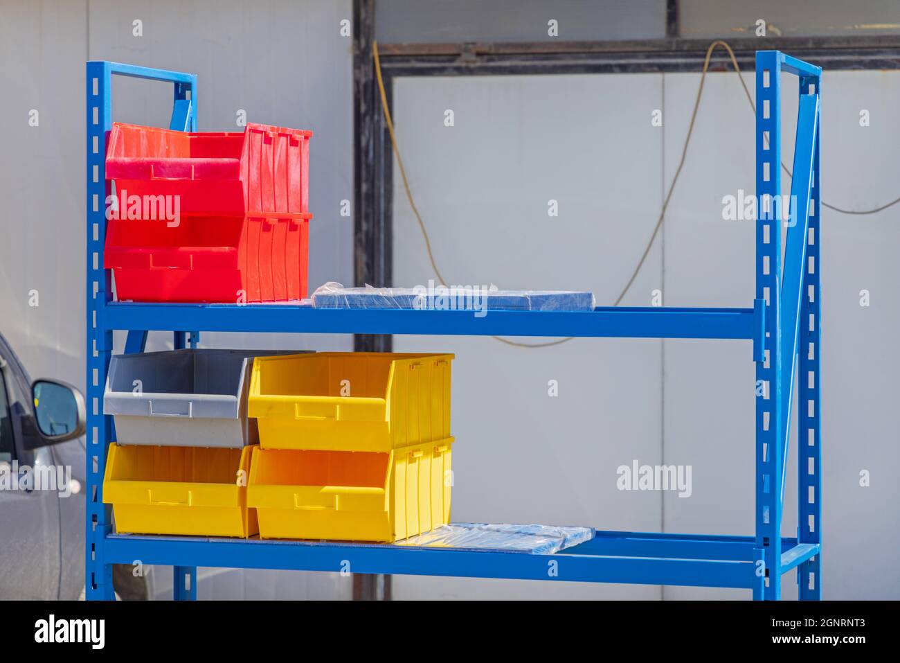 Plastic Tray Bins at Shelf in Garage Storage Space Stock Photo - Alamy