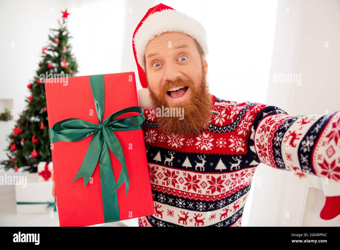 Photo of smiling excited crazy handsome male take selfie with big ...