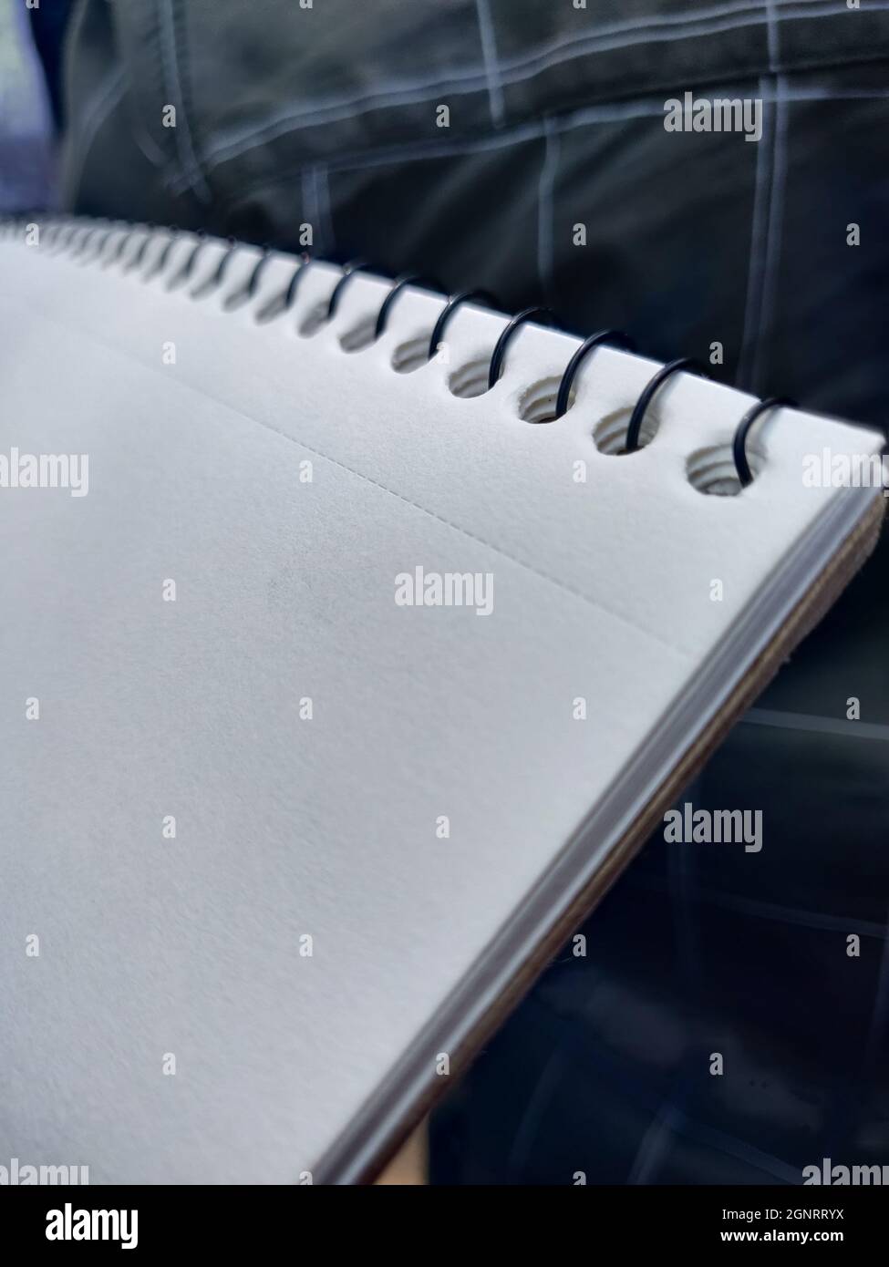 plain white book with spiral binding and dark background Stock Photo ...