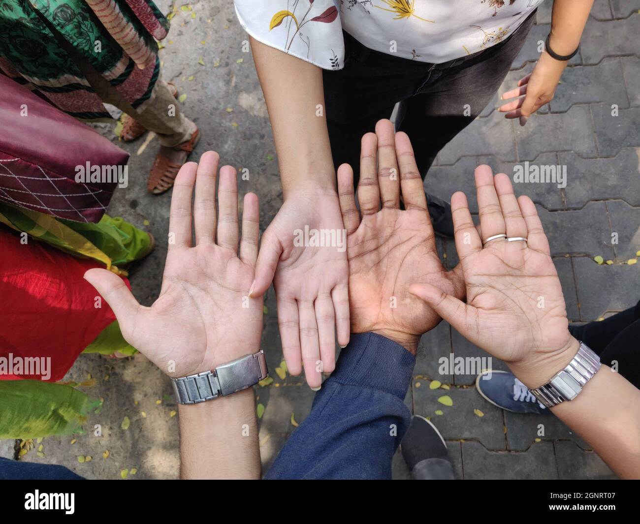random hands together with different skin color Stock Photo - Alamy