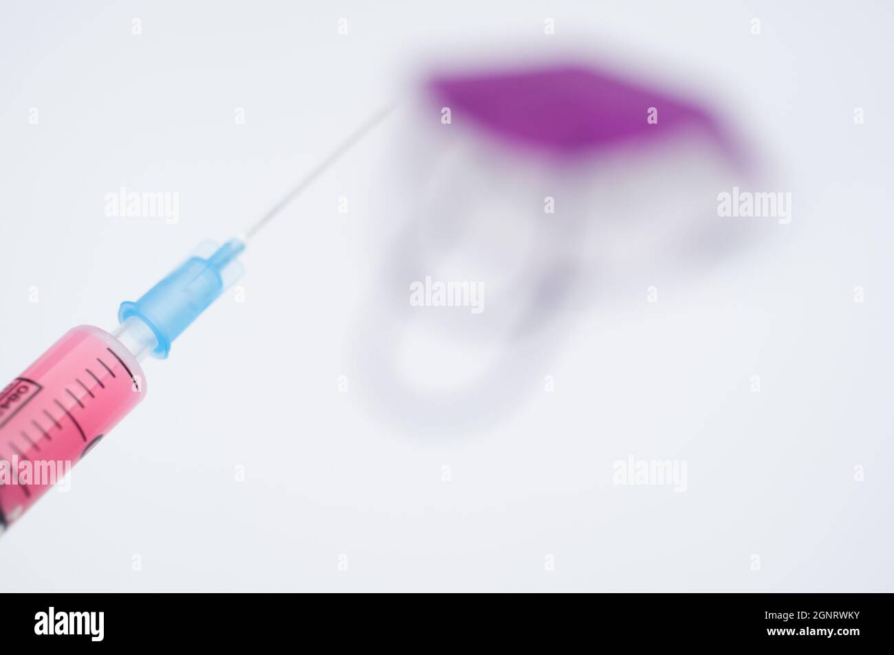 syringe and medical mask on a white background Stock Photo - Alamy