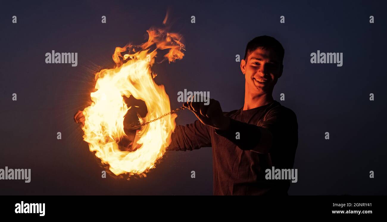 Man fire spinning poi hi-res stock photography and images - Alamy