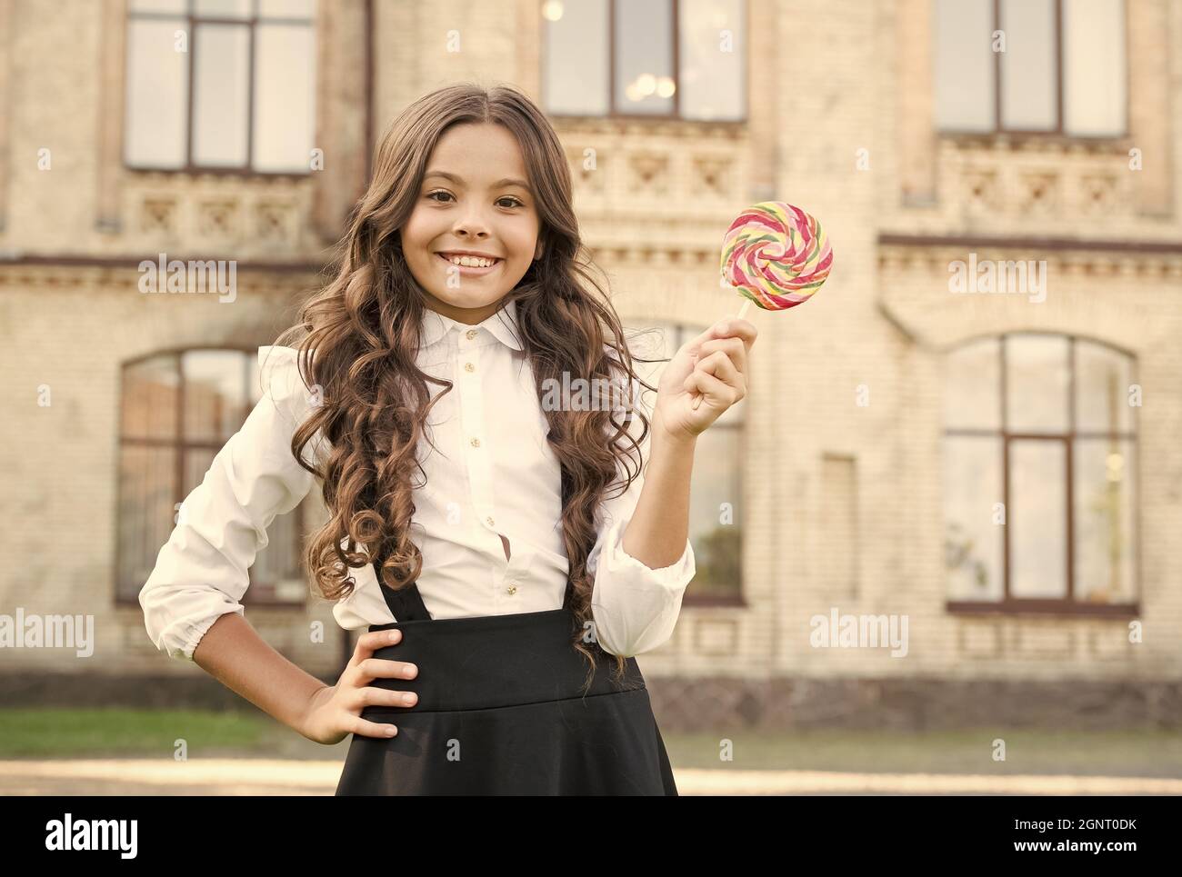 Sweet joy. Happy kid with sweet candy. Happy childhood. Kid child ...