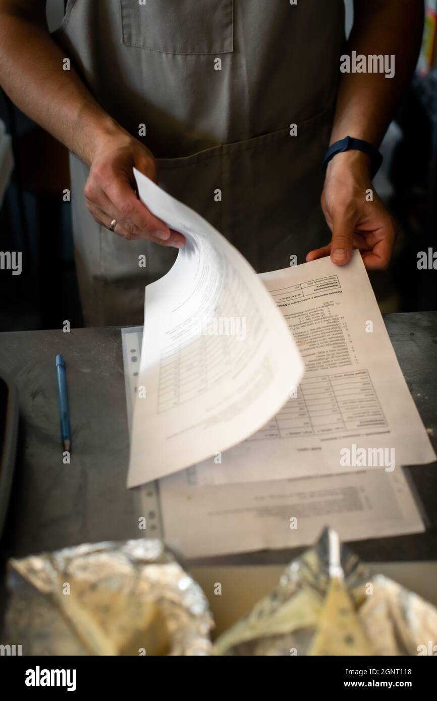 The baker looks through the recipe. Problem solving concept Stock Photo ...