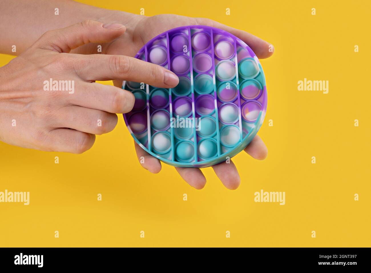 Female hans using pastel color round popit toy antistress for children ...