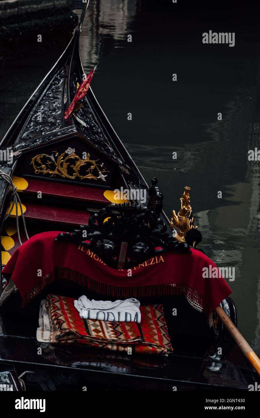 Vertical shot of the famous traditional Venetian rowing Gondola boat ...