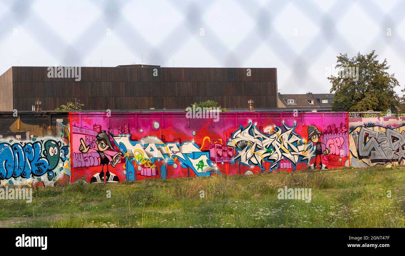Colorful graffiti decorating contemporary building wall in Cologne ...