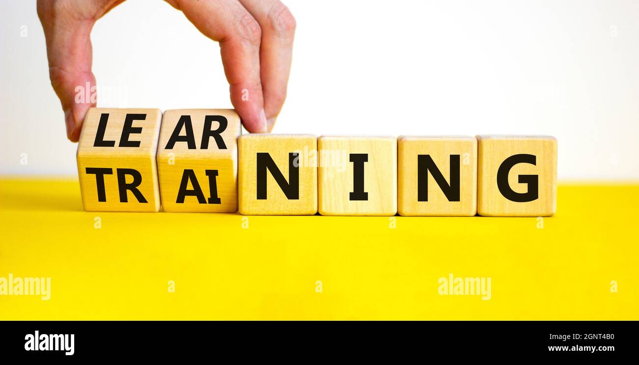 Training and learning symbol. Businessman turns wooden cubes and ...