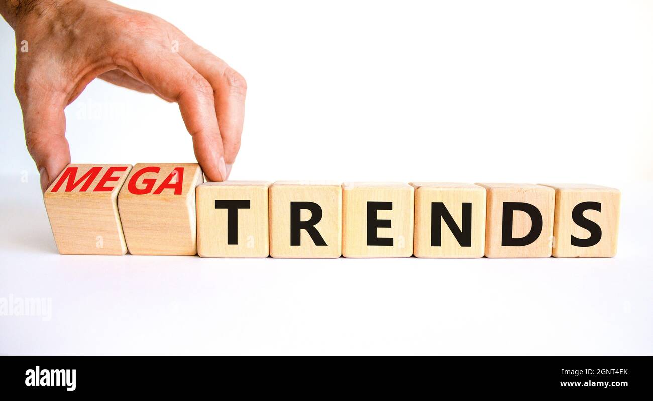 Trends or megatrends symbol. Businessman turns cubes and changes words ...