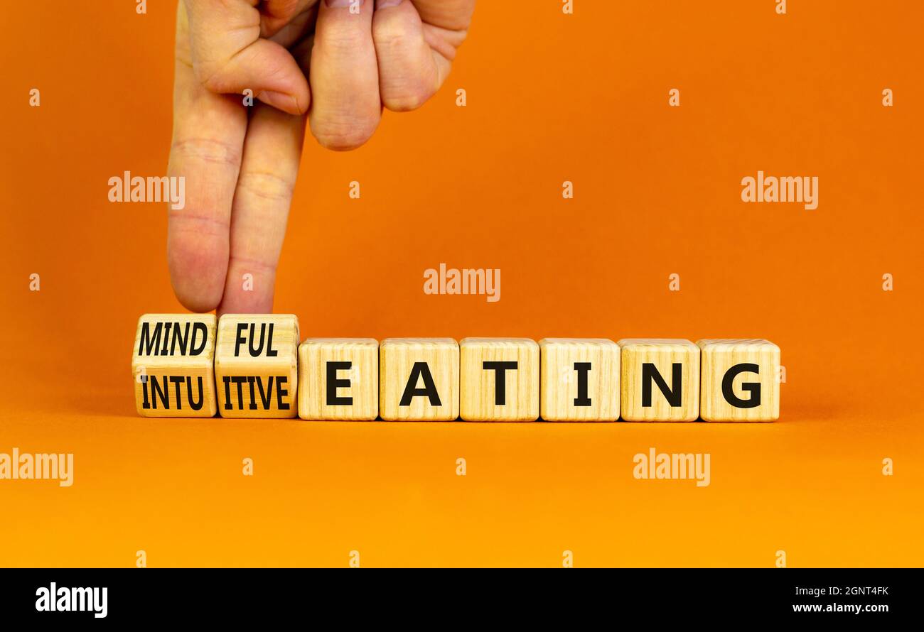 Mindful or intuitive eating symbol. Doctor turns cubes and changes ...