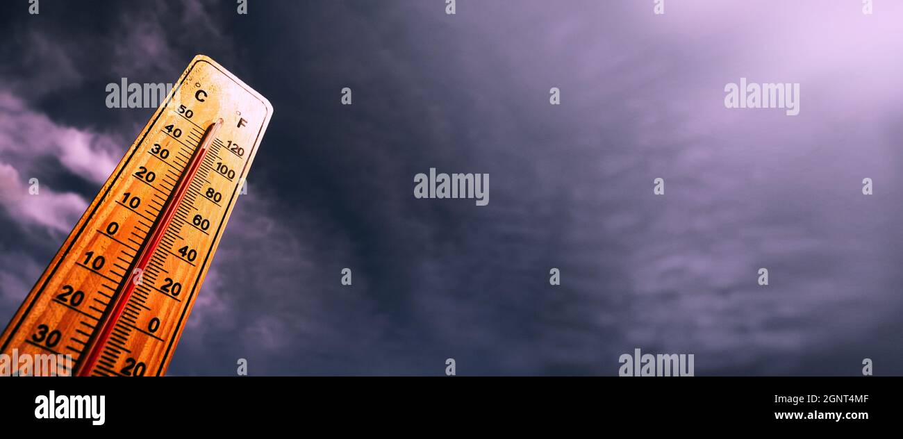 Wooden thermometer showing high temperature over 42 degrees Celsius on ...