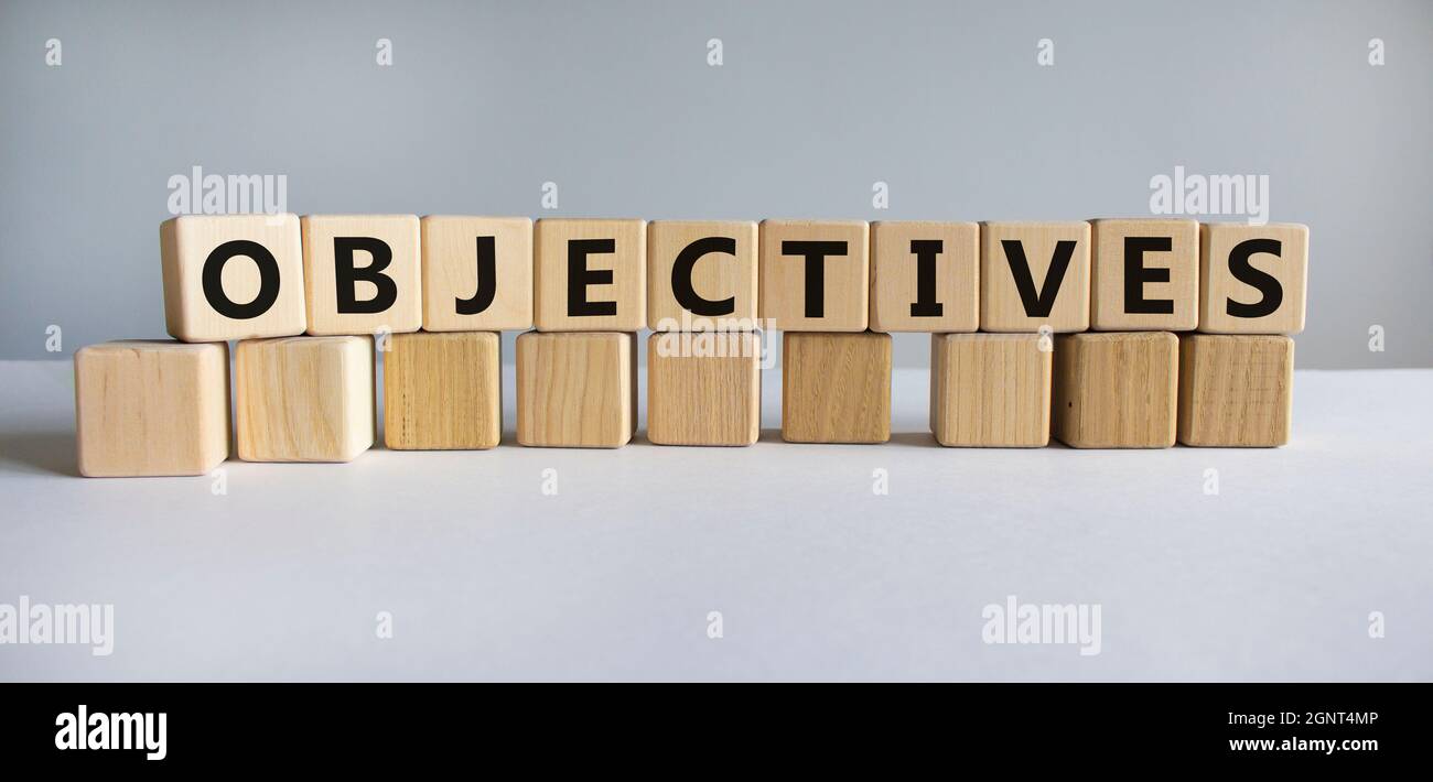 Objectives symbol. The word Objectives on wooden cubes. Beautiful white ...
