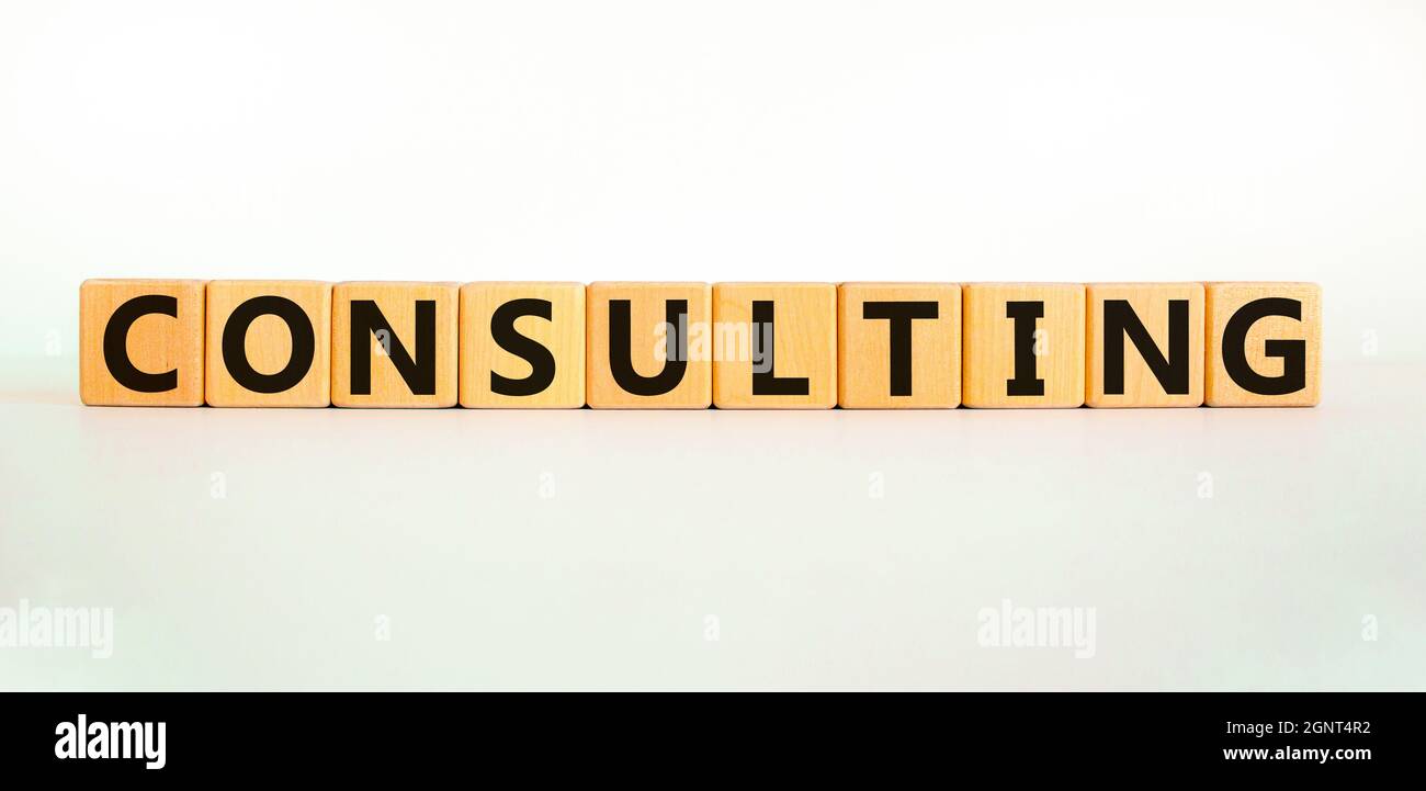 Consulting symbol. The word Consulting on wooden cubes. Beautiful white ...