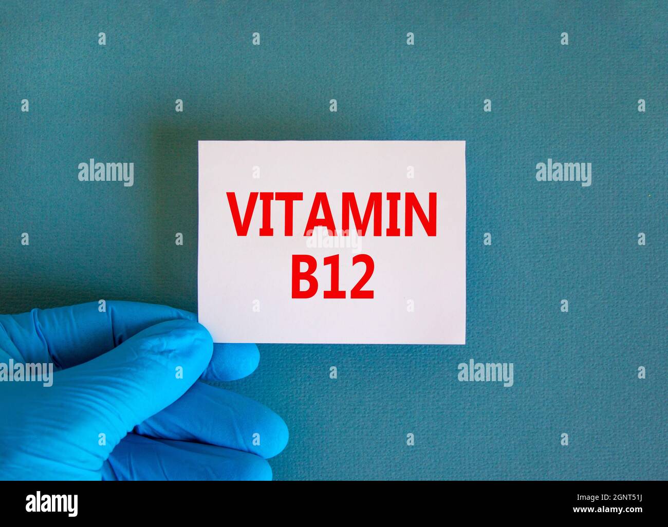 Vitamin B12 symbol. White note with words Vitamin B12, beautiful blue ...